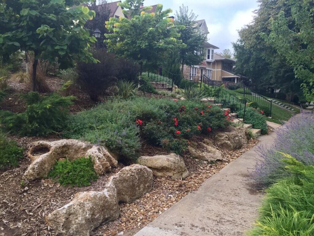 6 Landscape Design Ideas for a Sloped Yard - High Prairie Outdoors & Pools